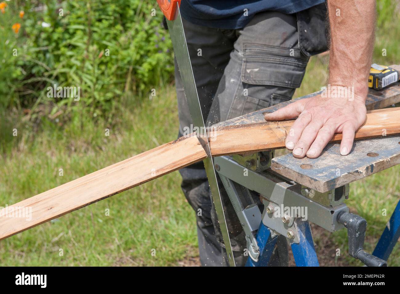 Sawing wood outside hi-res stock photography and images - Alamy
