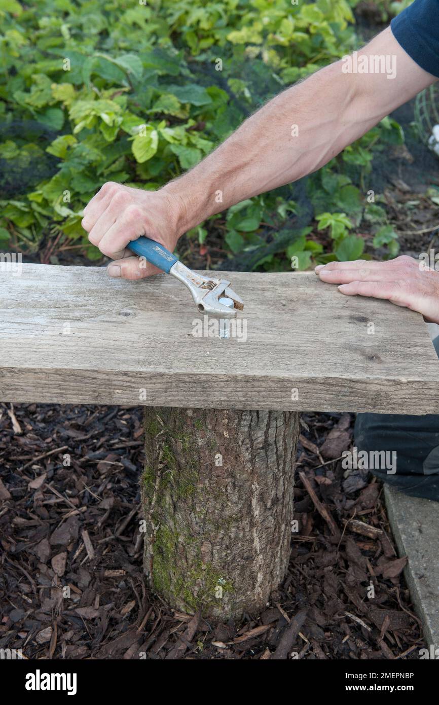 Constructing a bench using a wrench Stock Photo - Alamy