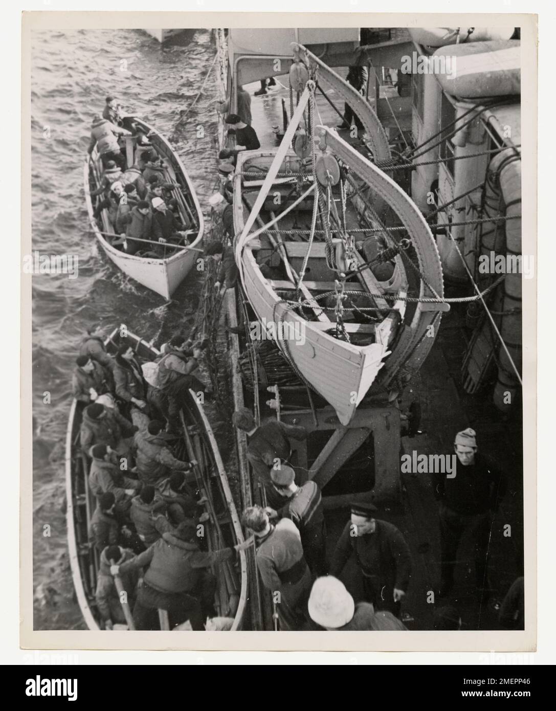 Small Boats and a Large Ship. This image depicts several small boats ...
