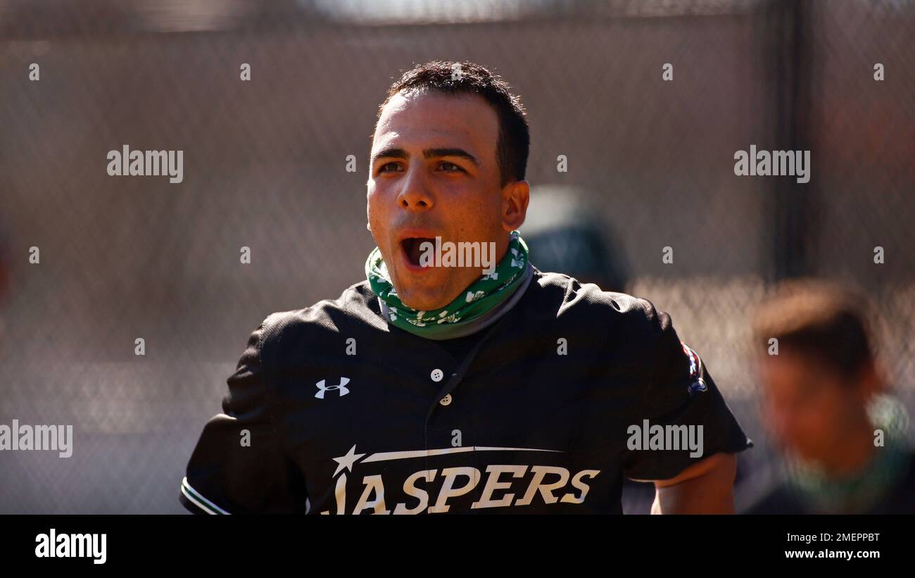Manhattan's Jonathan Barditch reacts after hitting a home run against ...
