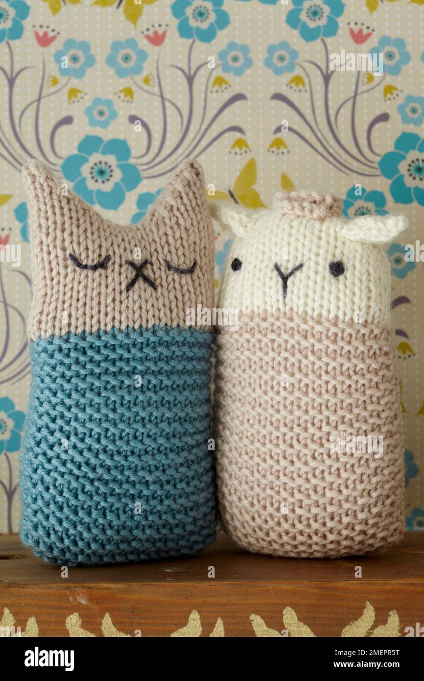 Knitted cat and sheep, front view Stock Photo - Alamy