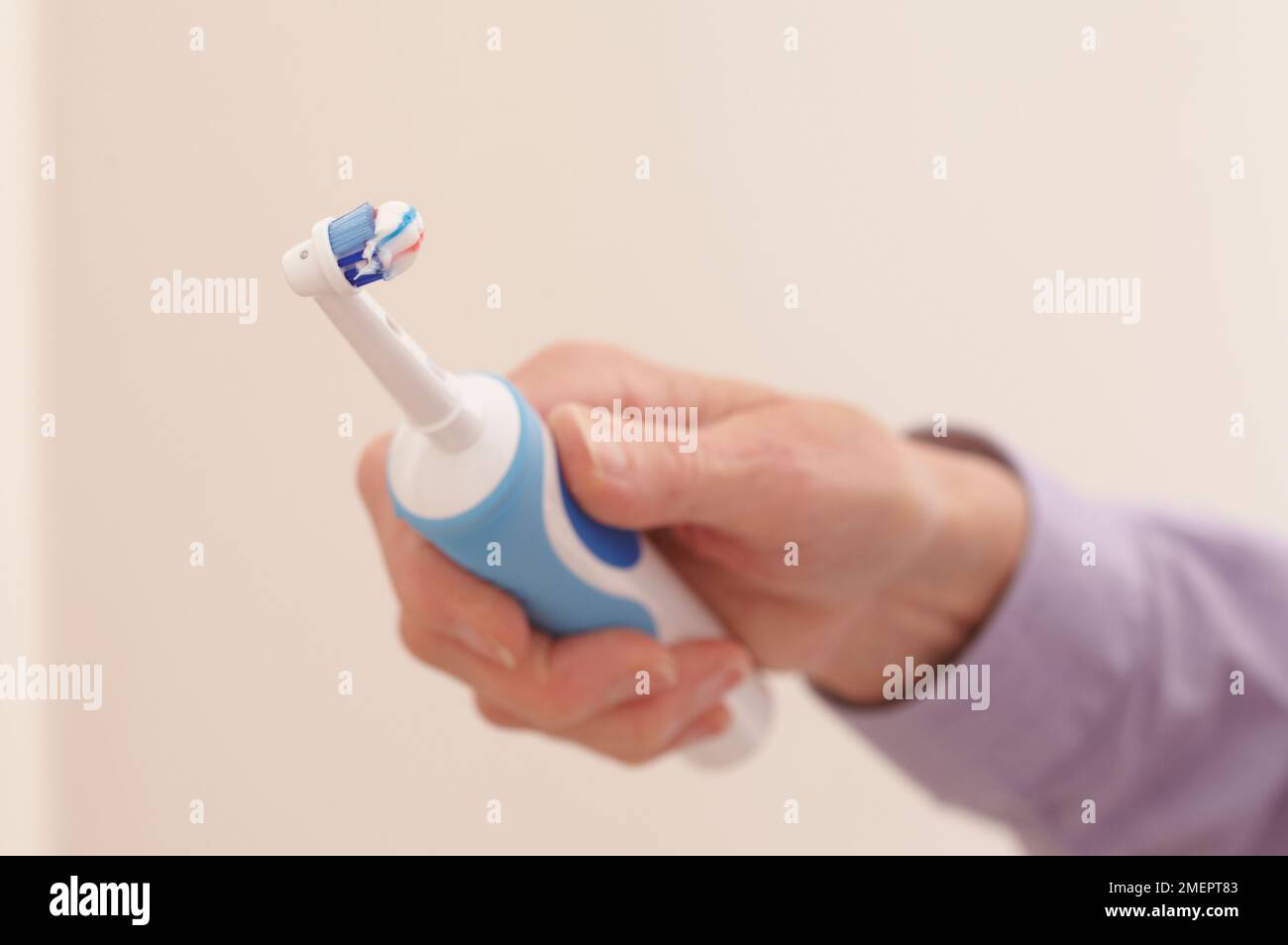 Woman hand holding toothbrush hi-res stock photography and images - Alamy