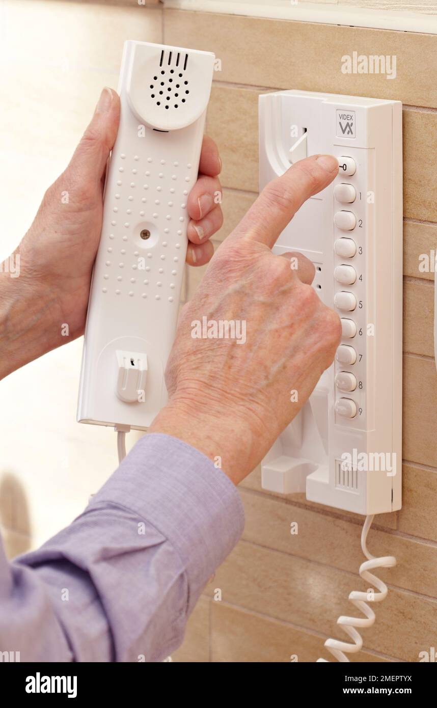 Home safety and security, using an intercom Stock Photo - Alamy