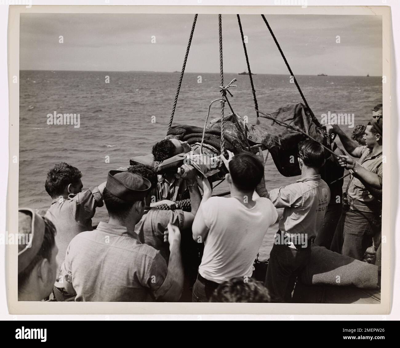 Coast Guardsmen aboard a combat transport at Eniwetok in the Marshall ...