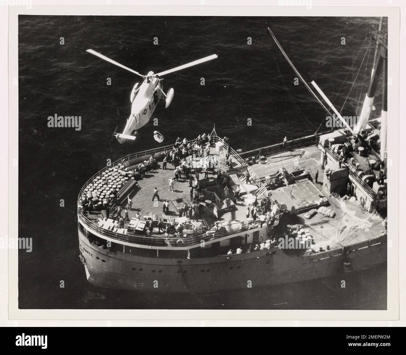 A Coast Guard helicopter assists in the rescue of Captain Hugh La ...