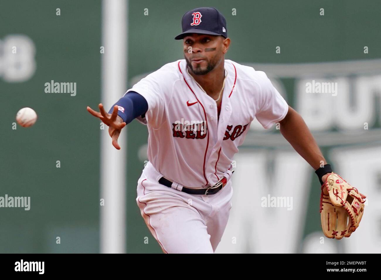 Boston Red Sox shortstop Xander Bogaerts tosses to second base for a ...