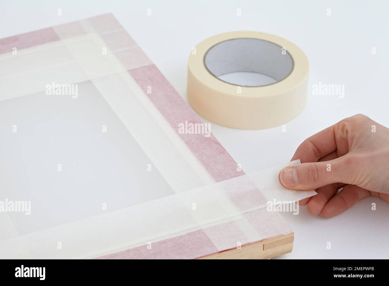 Preparing screen with masking tape before printing, close-up Stock ...