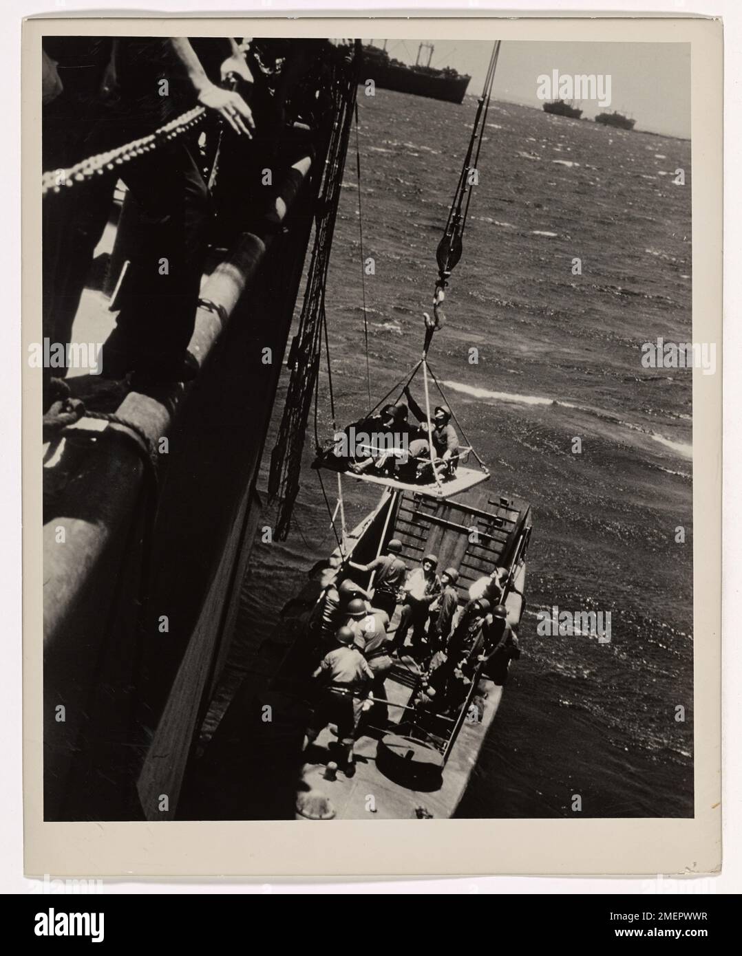 Wounded American soldiers from the battle of Saipan are hoisted aboard ...