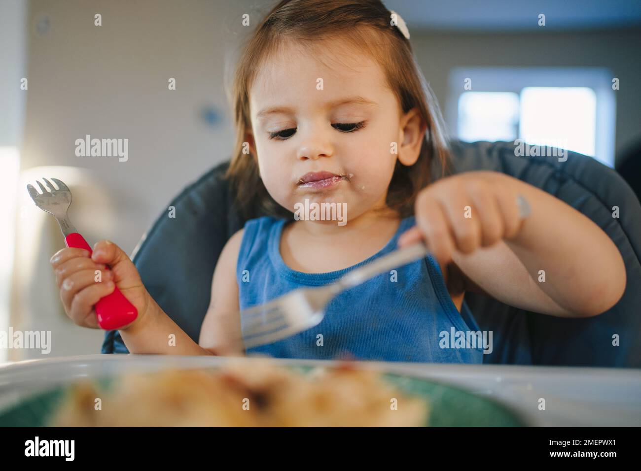 Children eating by herself hi-res stock photography and images - Alamy