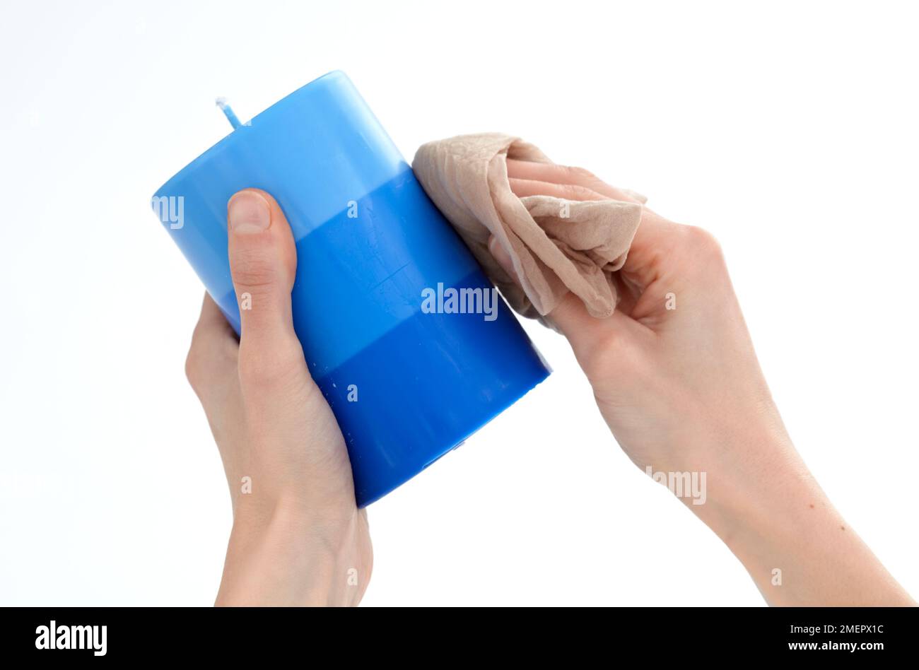 Woman using folded pair of nylon tights to rub lines which may have ...