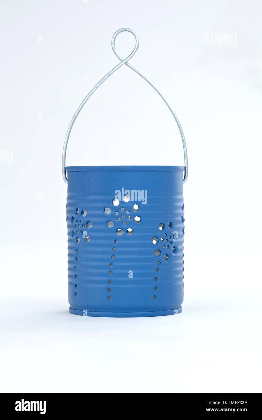 Tin can lantern with wire handle from recycled coat hanger, close-up ...