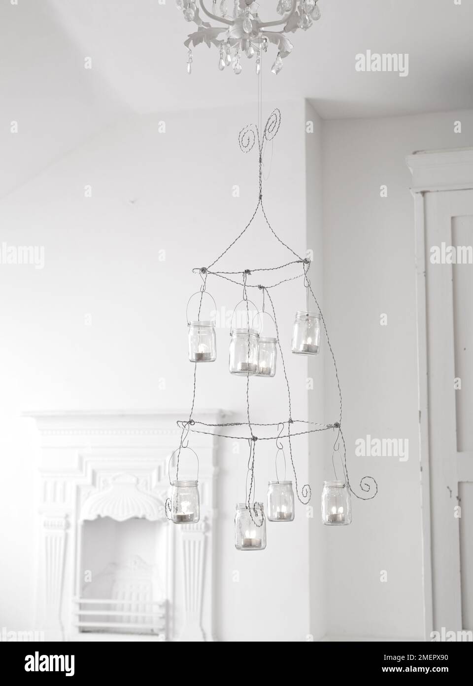 Homemade wire chandelier hanging from light fixture Stock Photo - Alamy