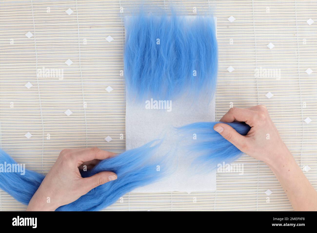 Using template for seamless felting, overhead view Stock Photo - Alamy