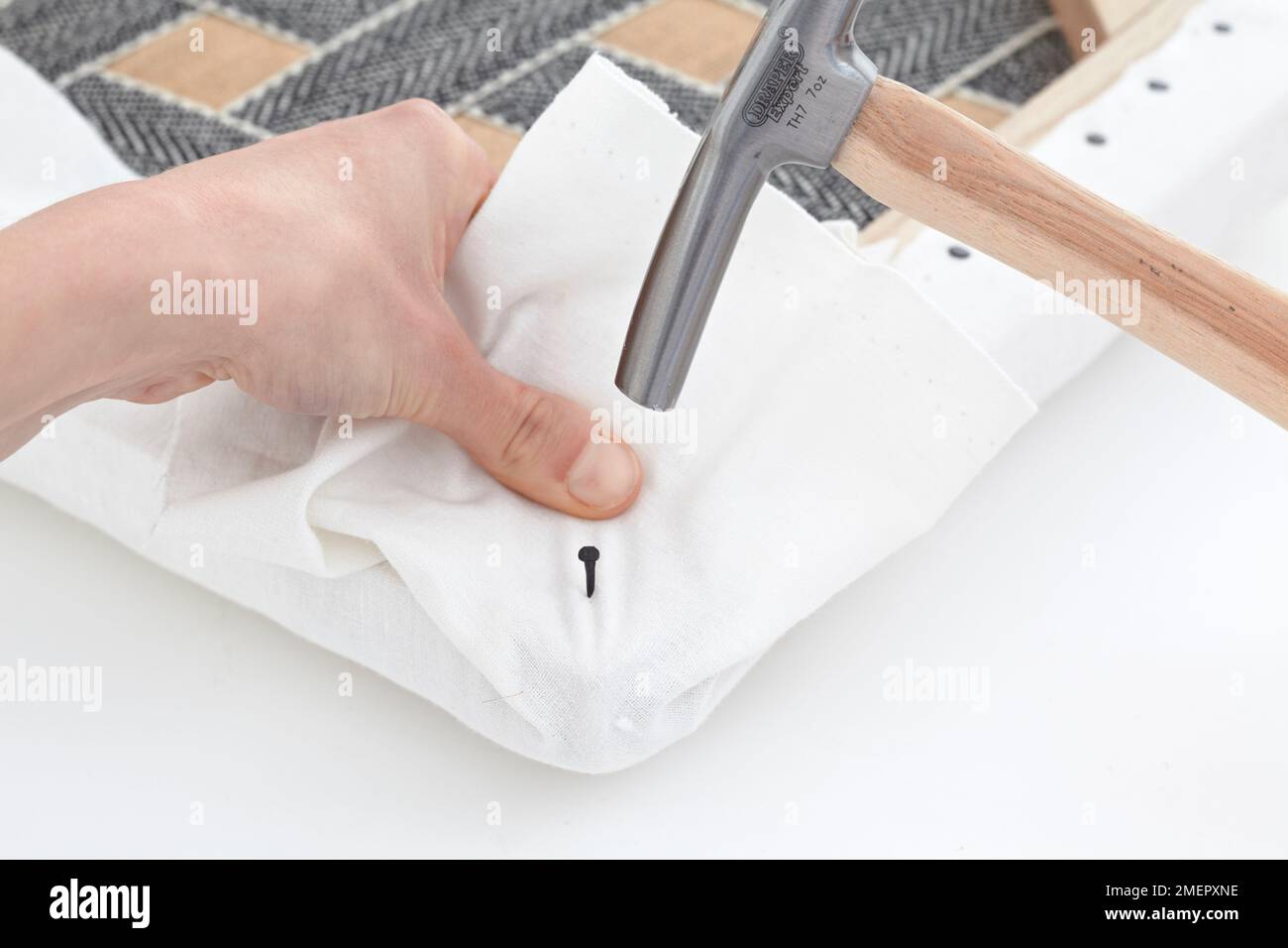 Neaten corners of pad by pulling the calico/barrier cloth firmly over ...