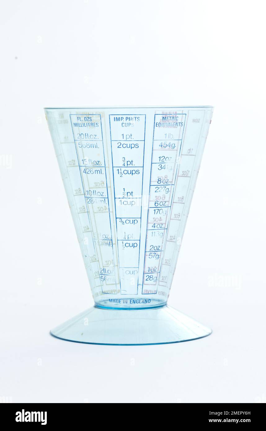 Funnel-shaped measuring cup, close-up Stock Photo - Alamy