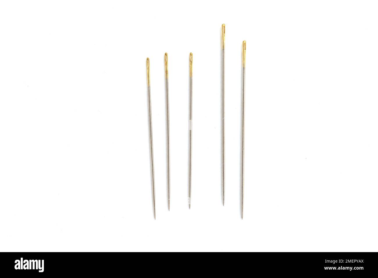 Row of embroidery needles, overhead view Stock Photo - Alamy