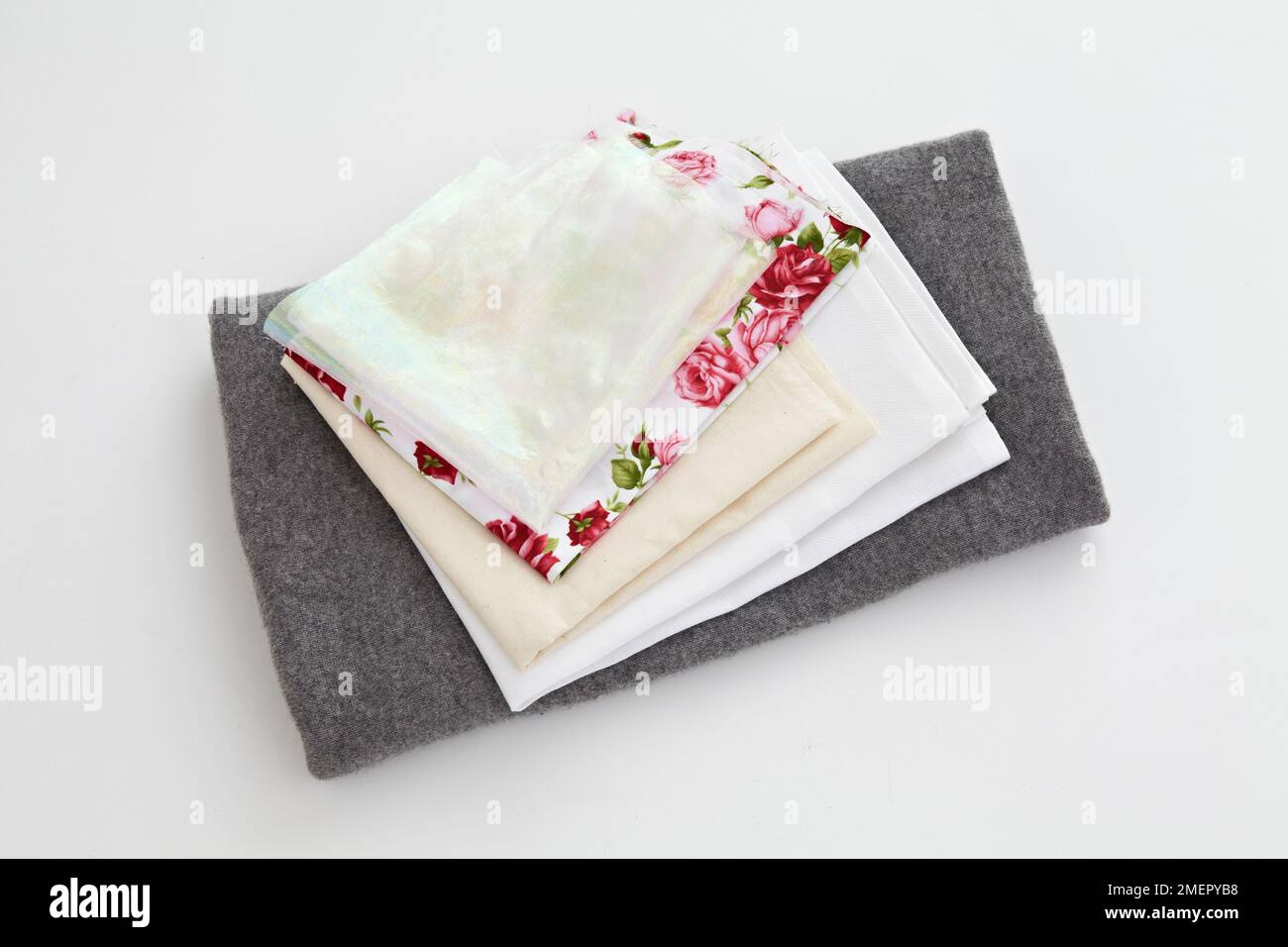 Stack of folded fabrics, elevated view Stock Photo - Alamy