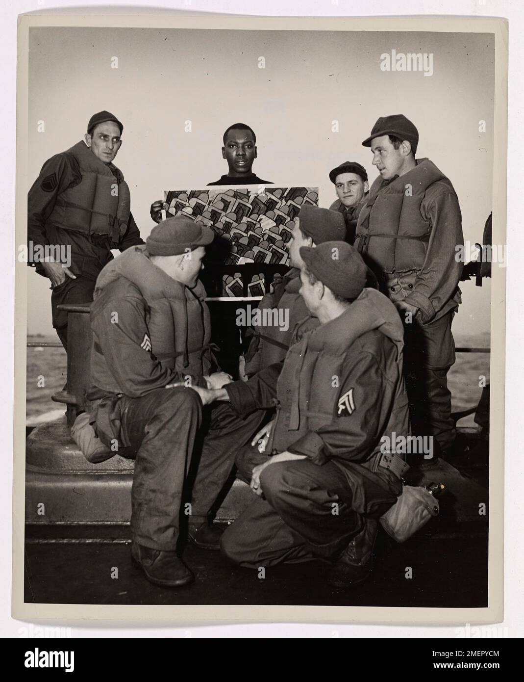 Coast Guard Combat Artist Jacob A. Lawrence is shown exhibiting one of ...