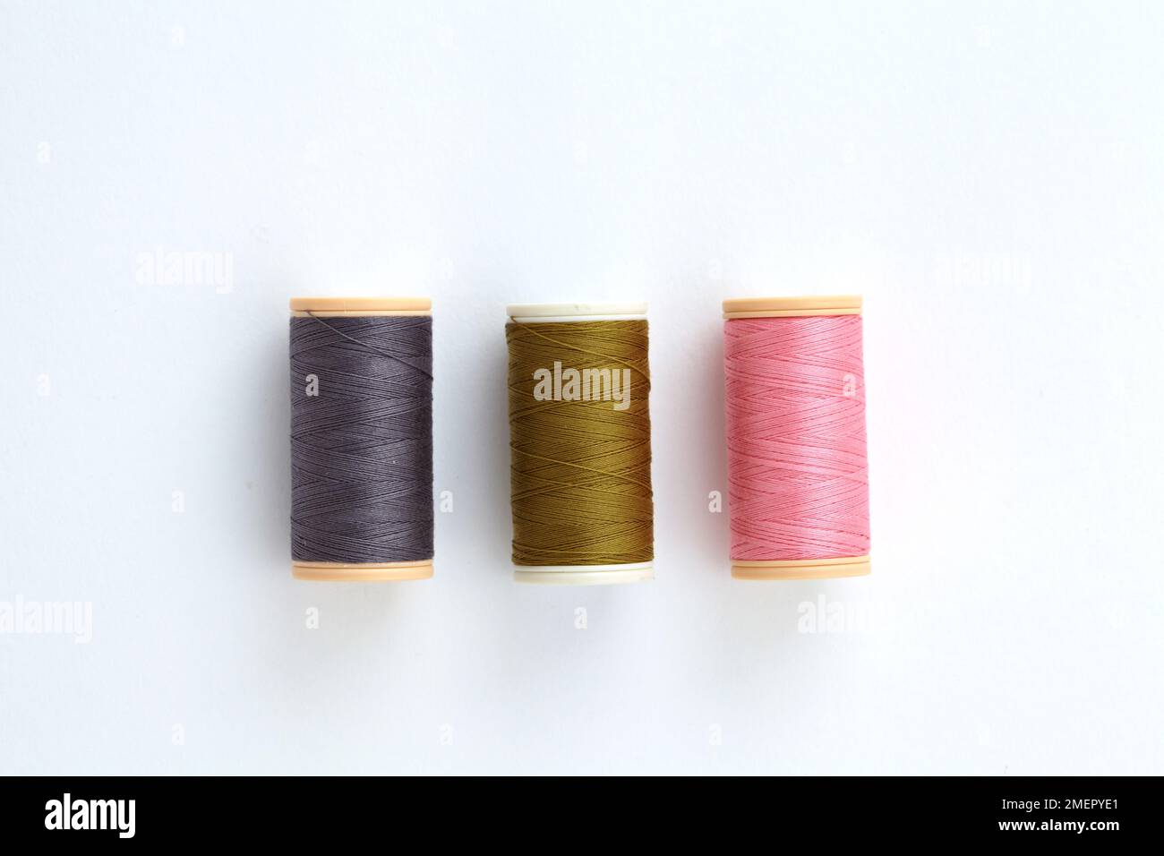 Three reels of sewing thread Stock Photo - Alamy