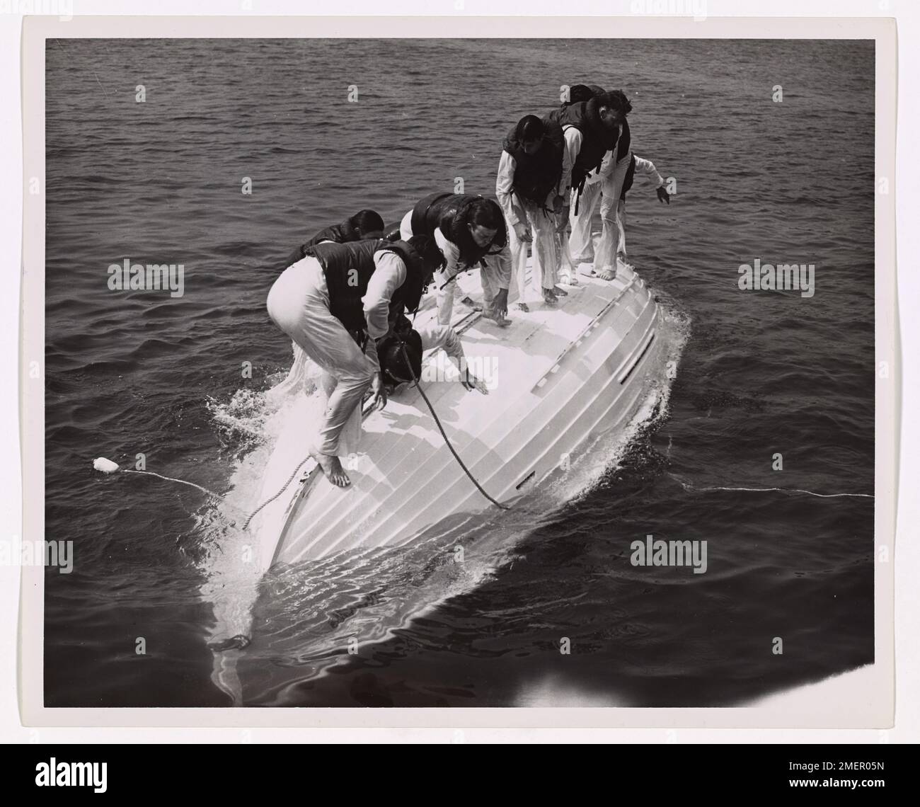 This series of action photos shows U.S. Coast Guardsmen practicing a ...