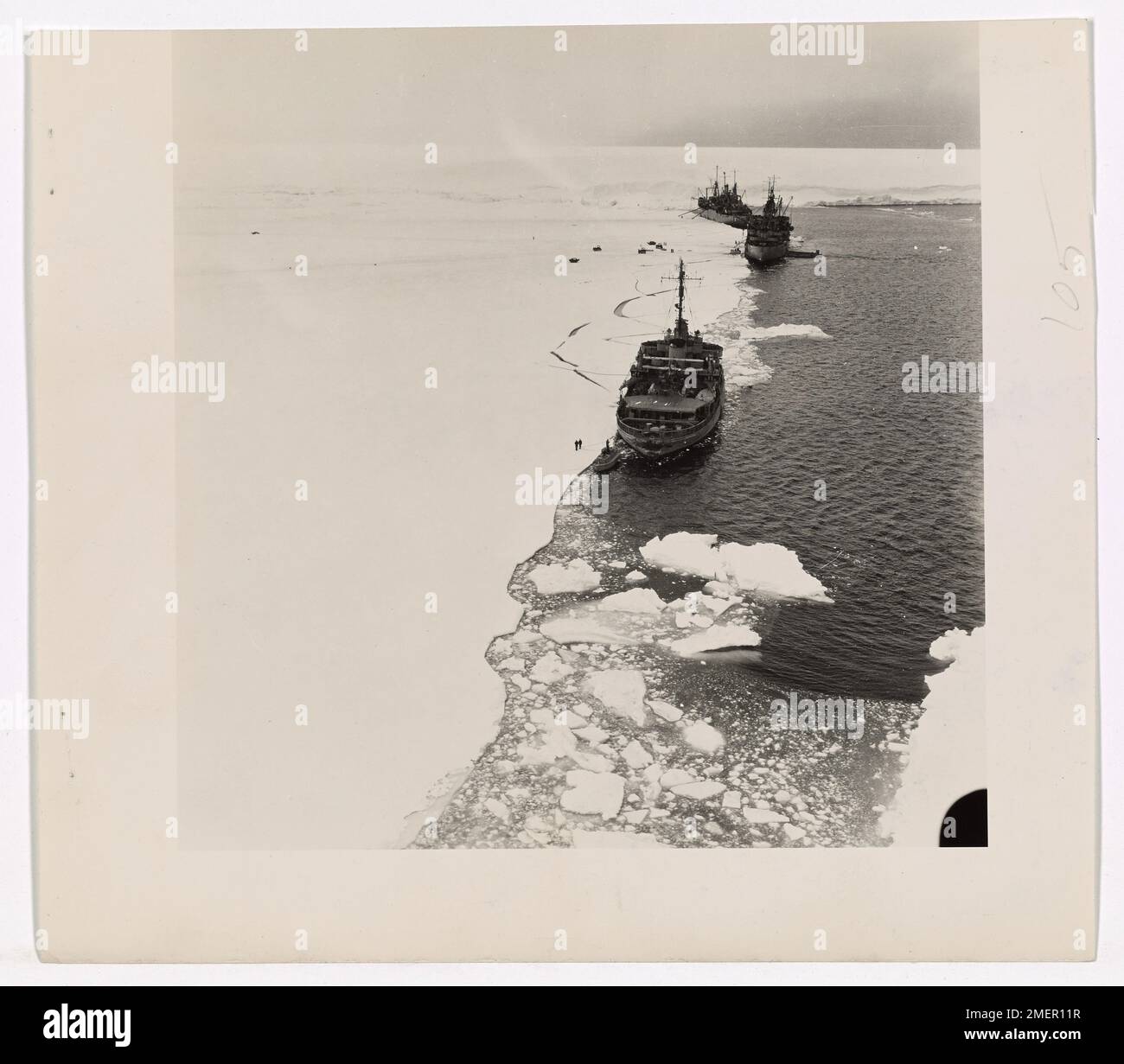 Ships break through icy waters during a mission, highlighting the Coast ...