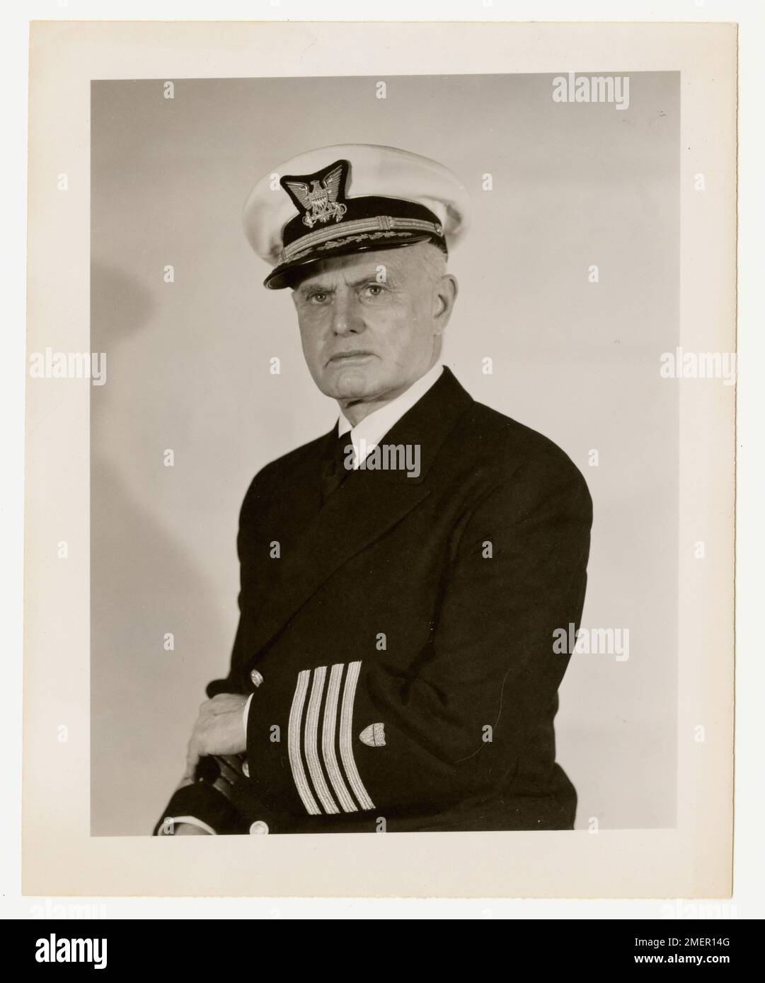 This photograph shows a Coast Guard Admiral, likely taken during WWII ...