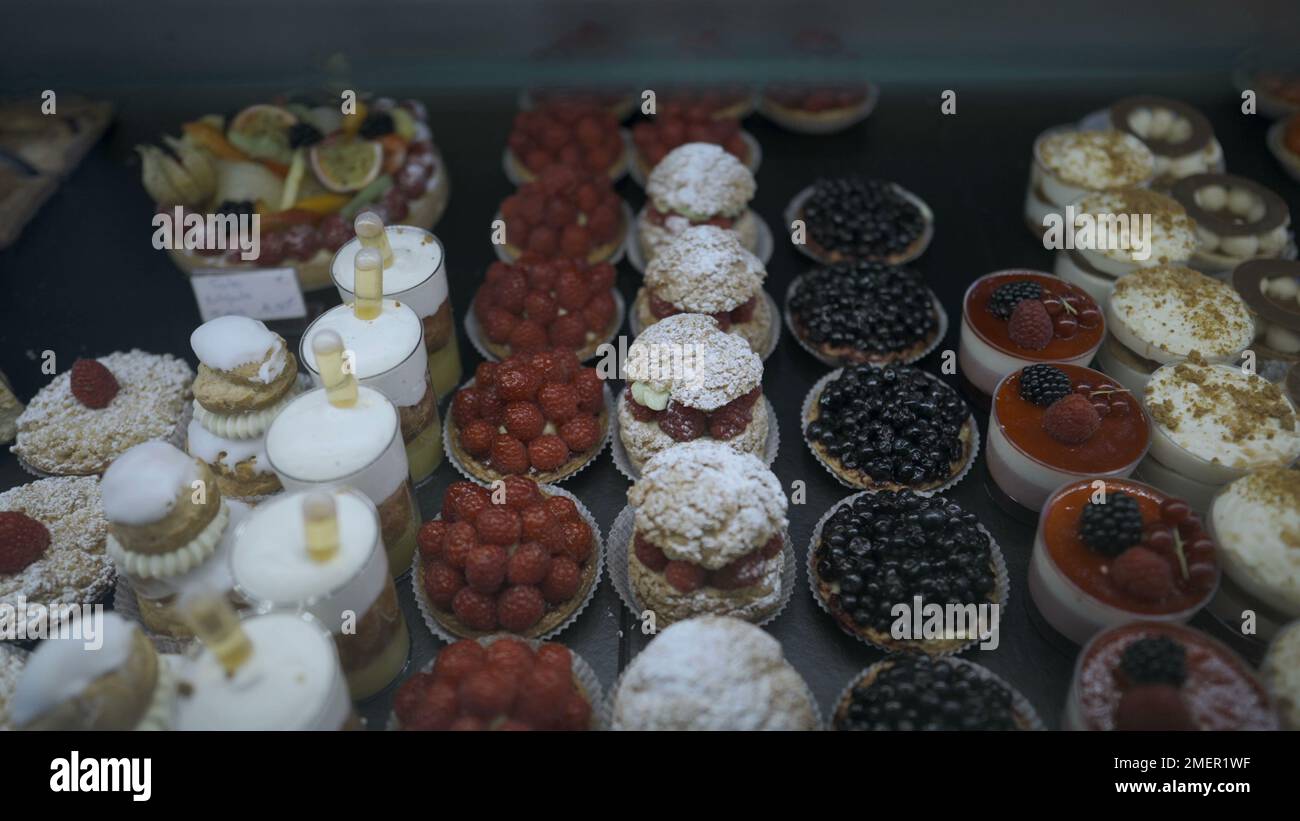 Sweet pastries on display at store Stock Photo - Alamy