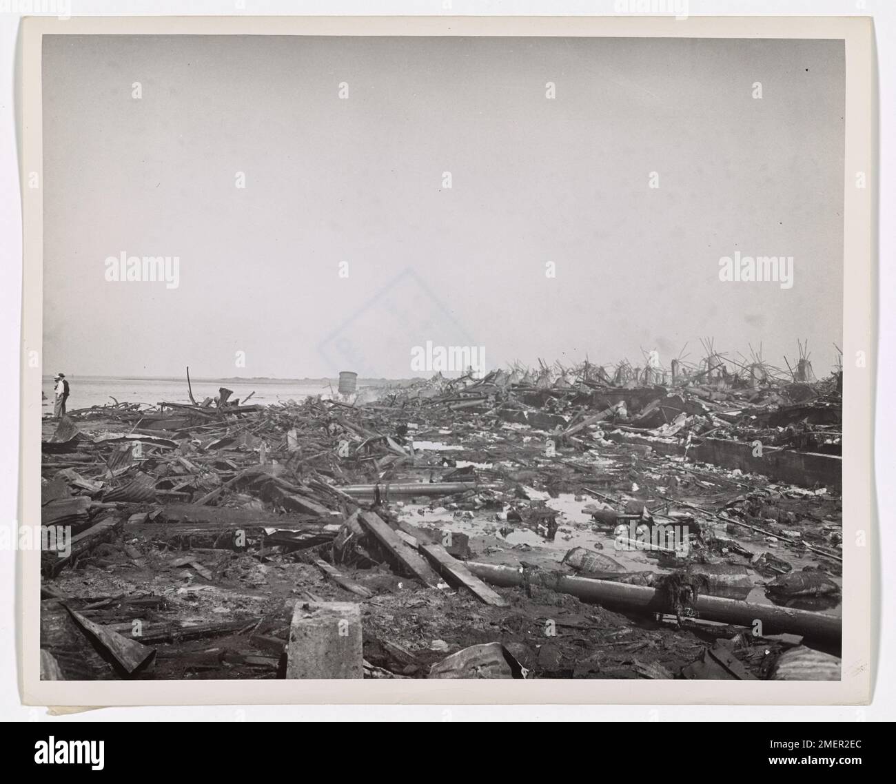 This image captures the aftermath of the Grandcamp explosion, showing ...