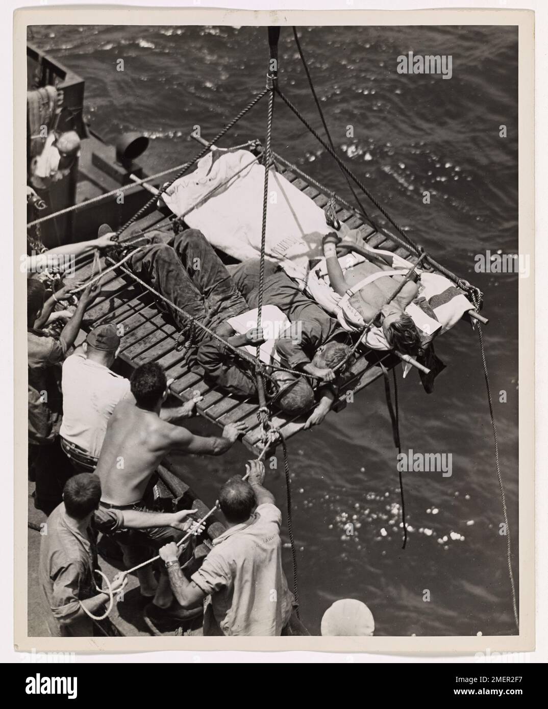 Wounded soldiers are evacuated from the beaches of Saipan aboard a ...