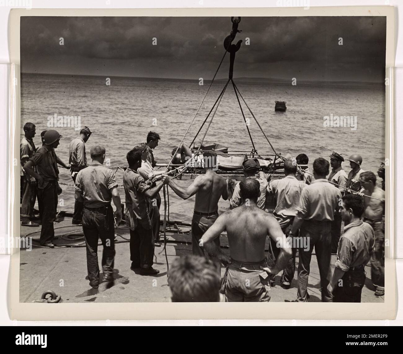 Wounded Fighter Hoisted Aboard Coast Guard-Manned Transport. An ...