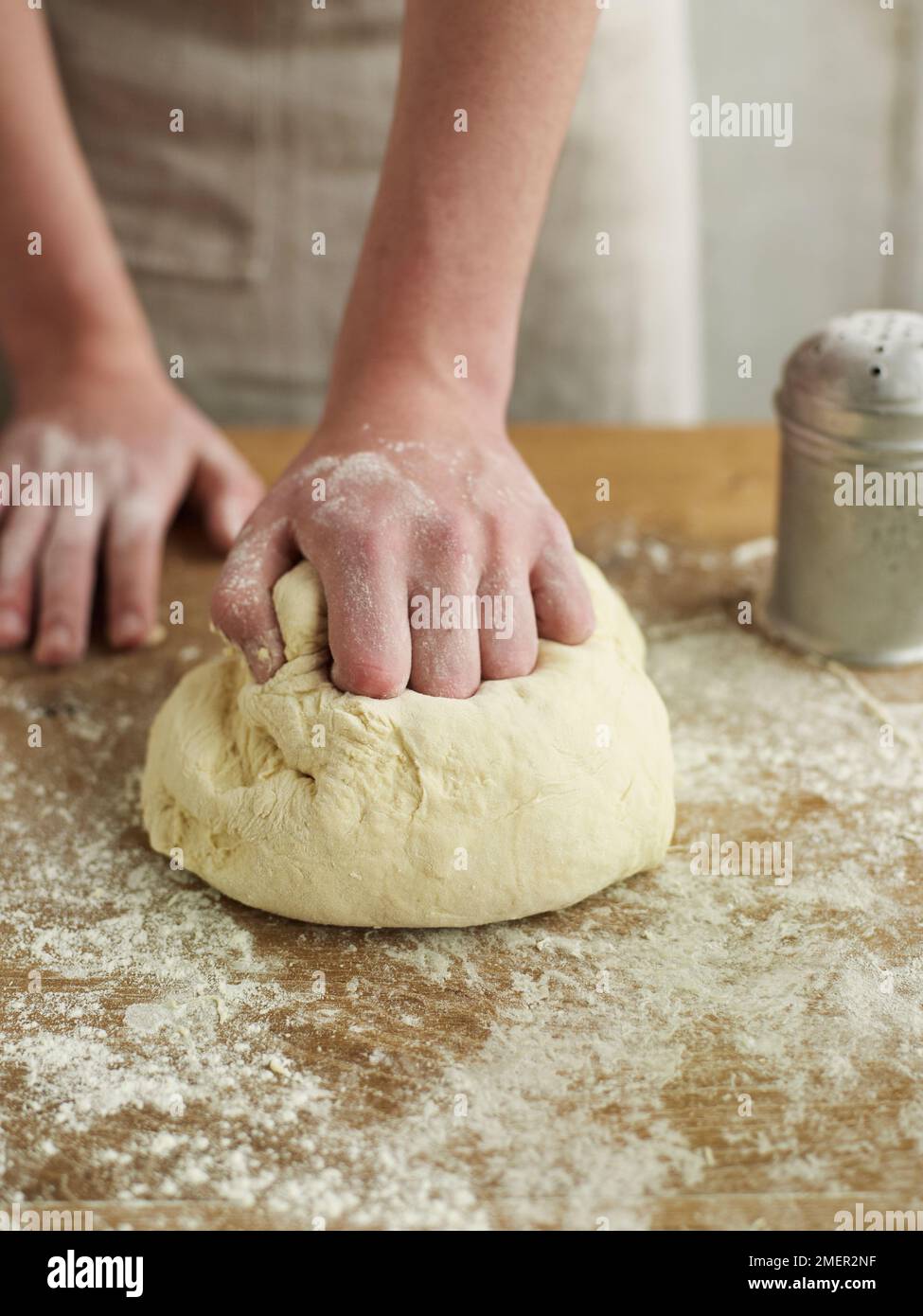 Kneading bread dough on floured surface Stock Photo - Alamy