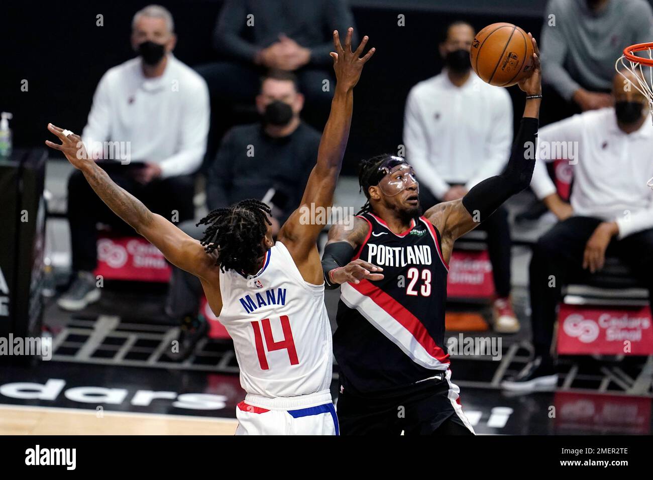 Portland Trail Blazers forward Robert Covington (23) drives past Los ...