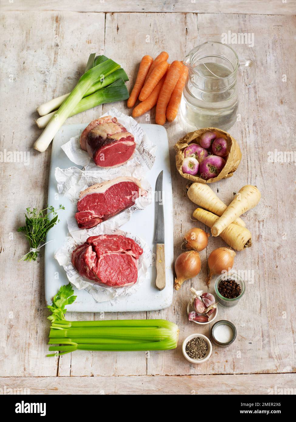 Fresh raw ingredients to make pot-au-feu, on wood background Stock ...