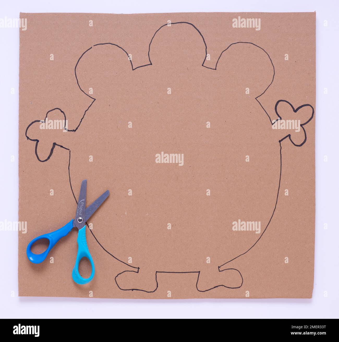 Outline of monster on cardboard, making cardboard cut out monster ...