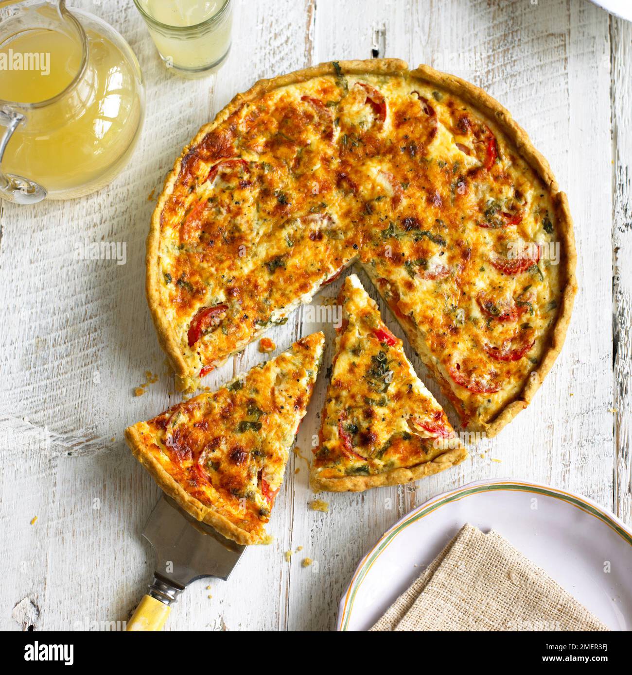 Tomato and dijon tart with parmesan and basil crust, two slices cut ...