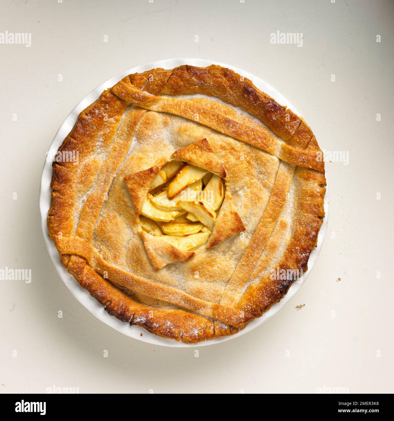 Apple pie with hole in the middle of the pie crust showing the filling ...