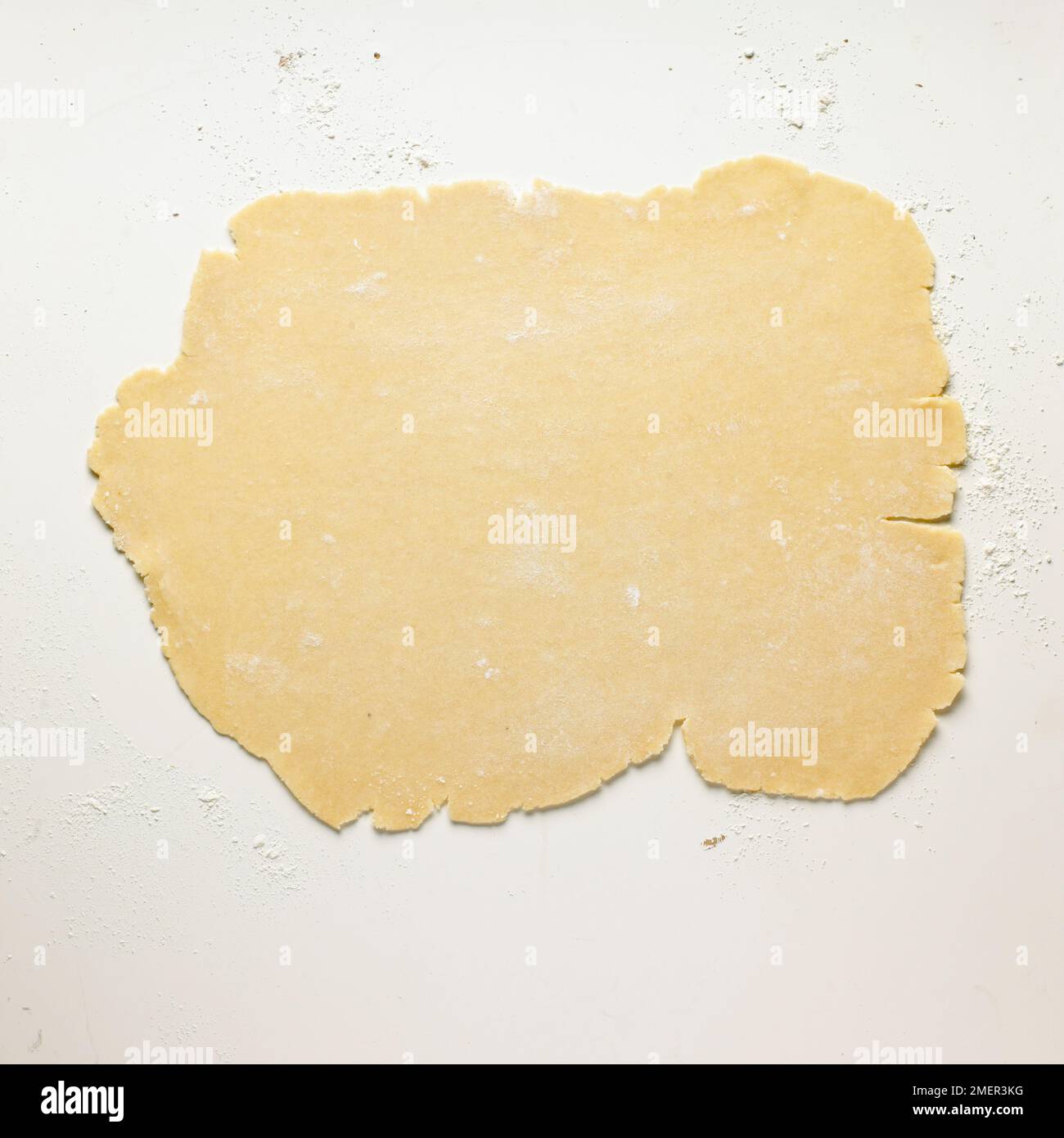 Pastry dough rolled out on floured surface Stock Photo - Alamy