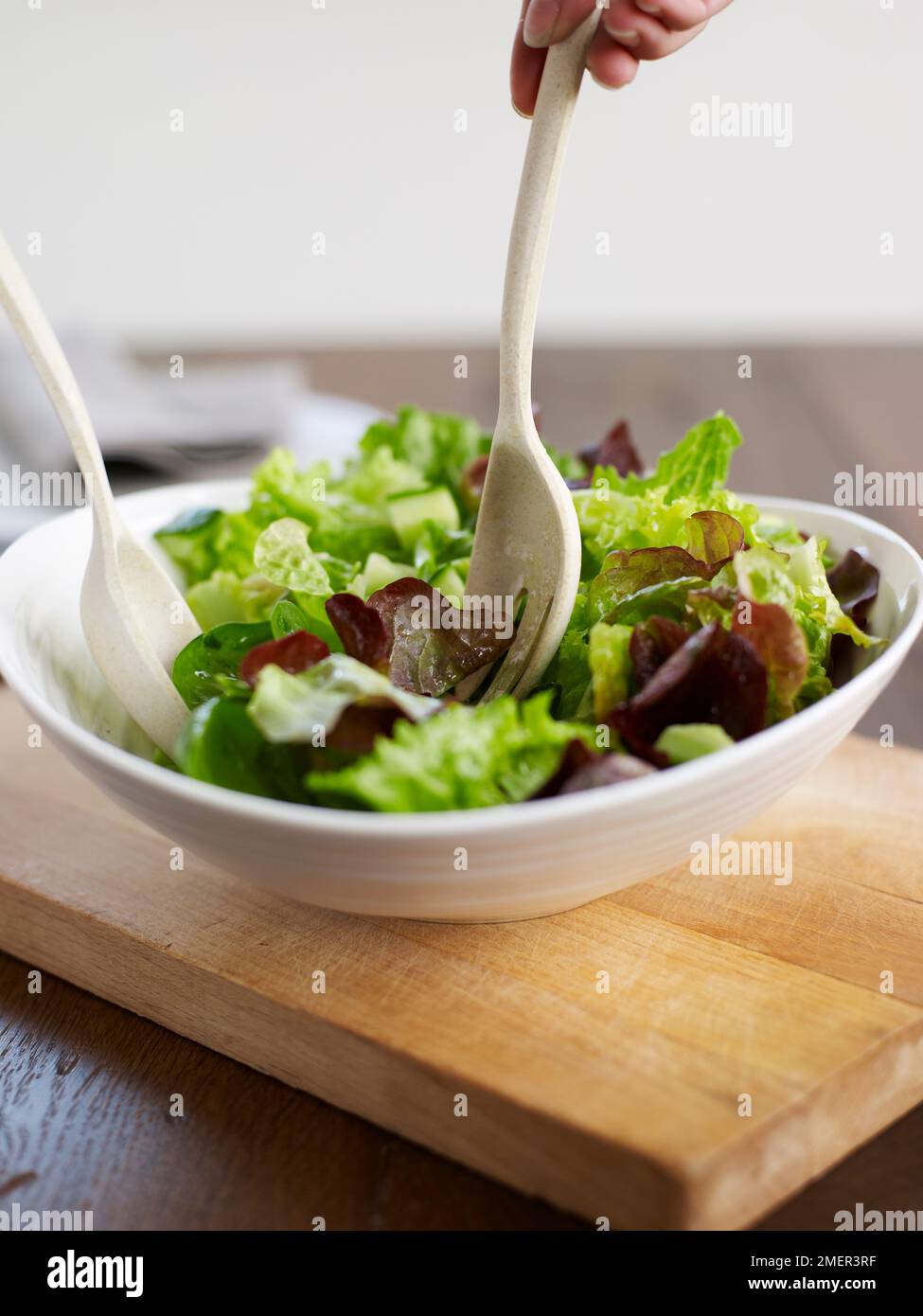 Tossing salad hi-res stock photography and images - Alamy