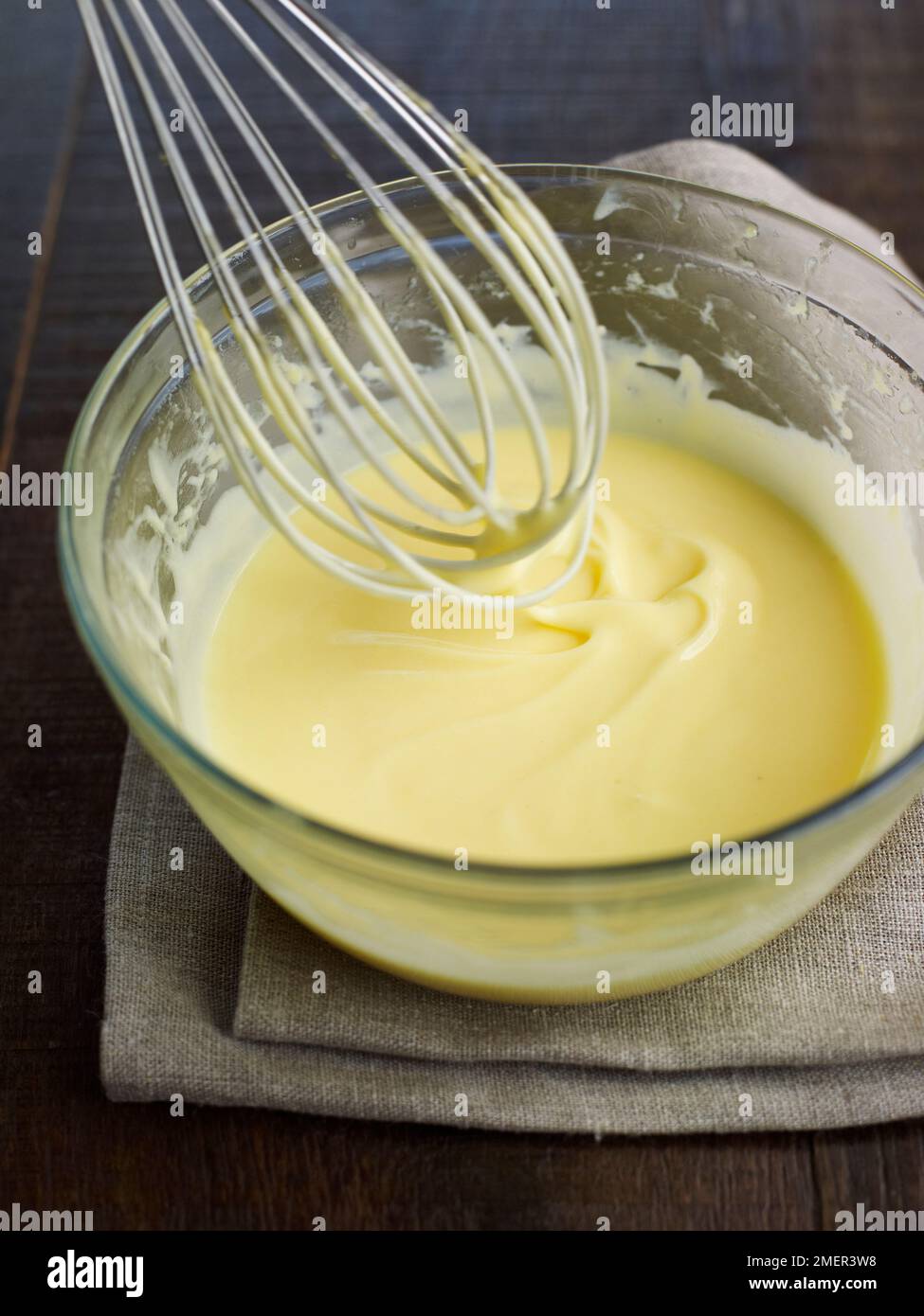Whisking hollandaise sauce Stock Photo - Alamy