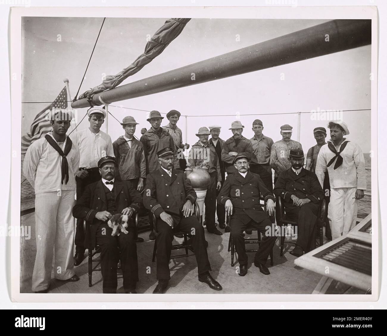Photograph of a Group of Men on the Deck of a Ship Stock Photo - Alamy