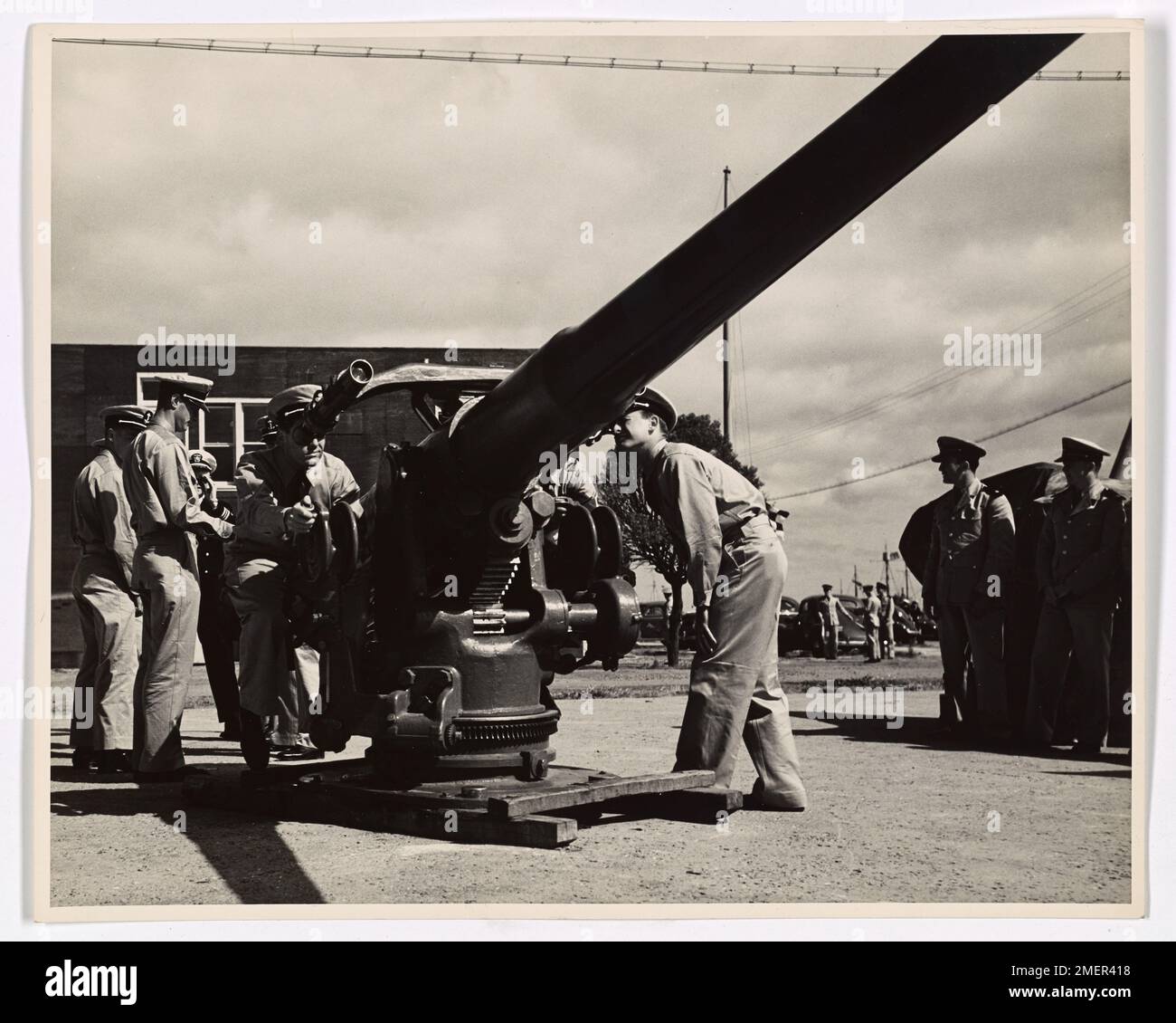 U.S. Maritime cadets are shown participating in a gun drill, training ...