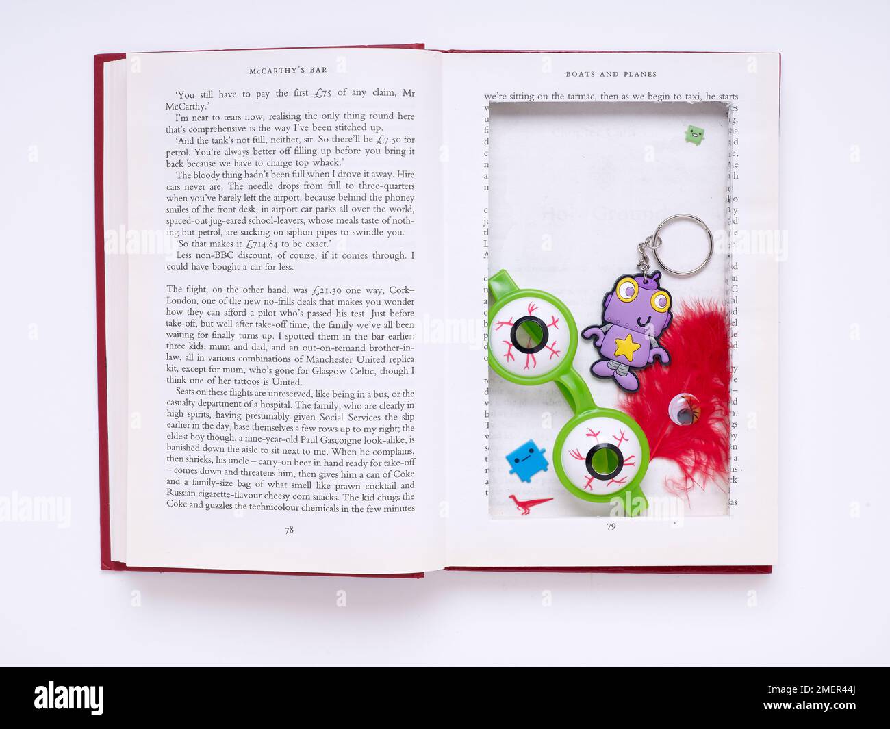 Secret book safe, book with inside cut out and filled with toys Stock ...