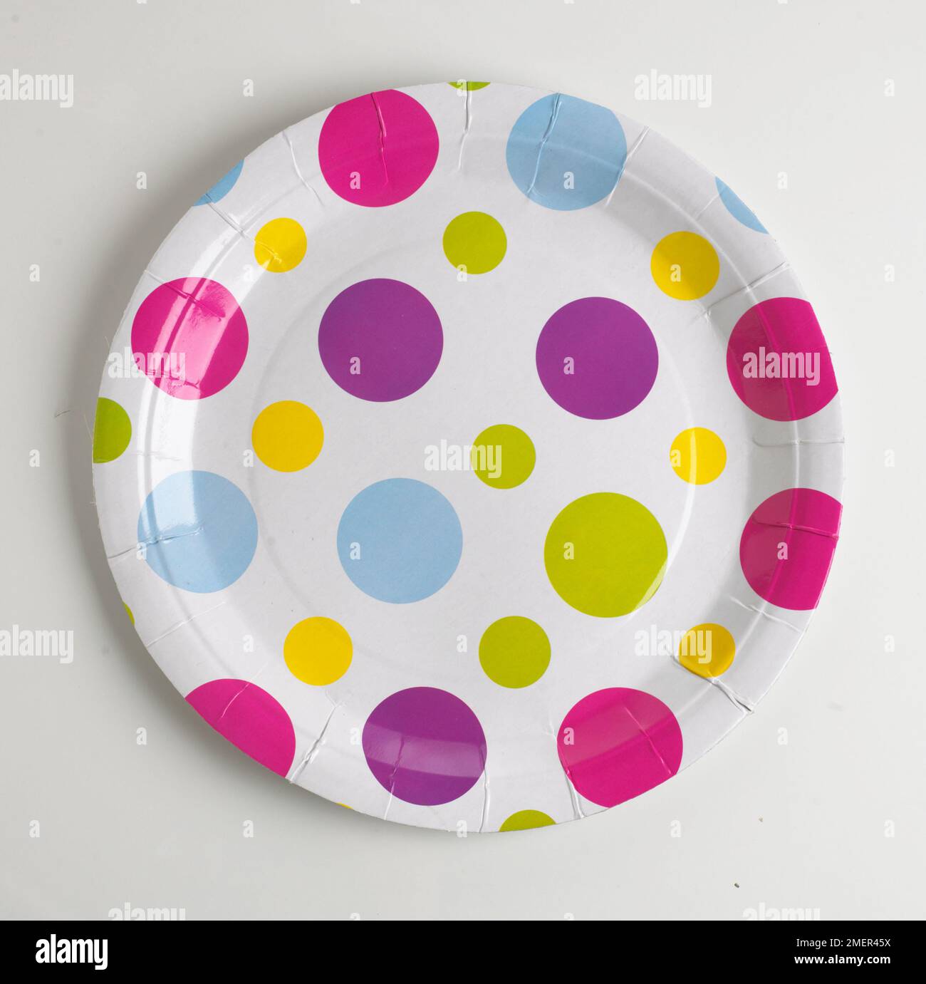 Colourful, spotted paper plate Stock Photo - Alamy