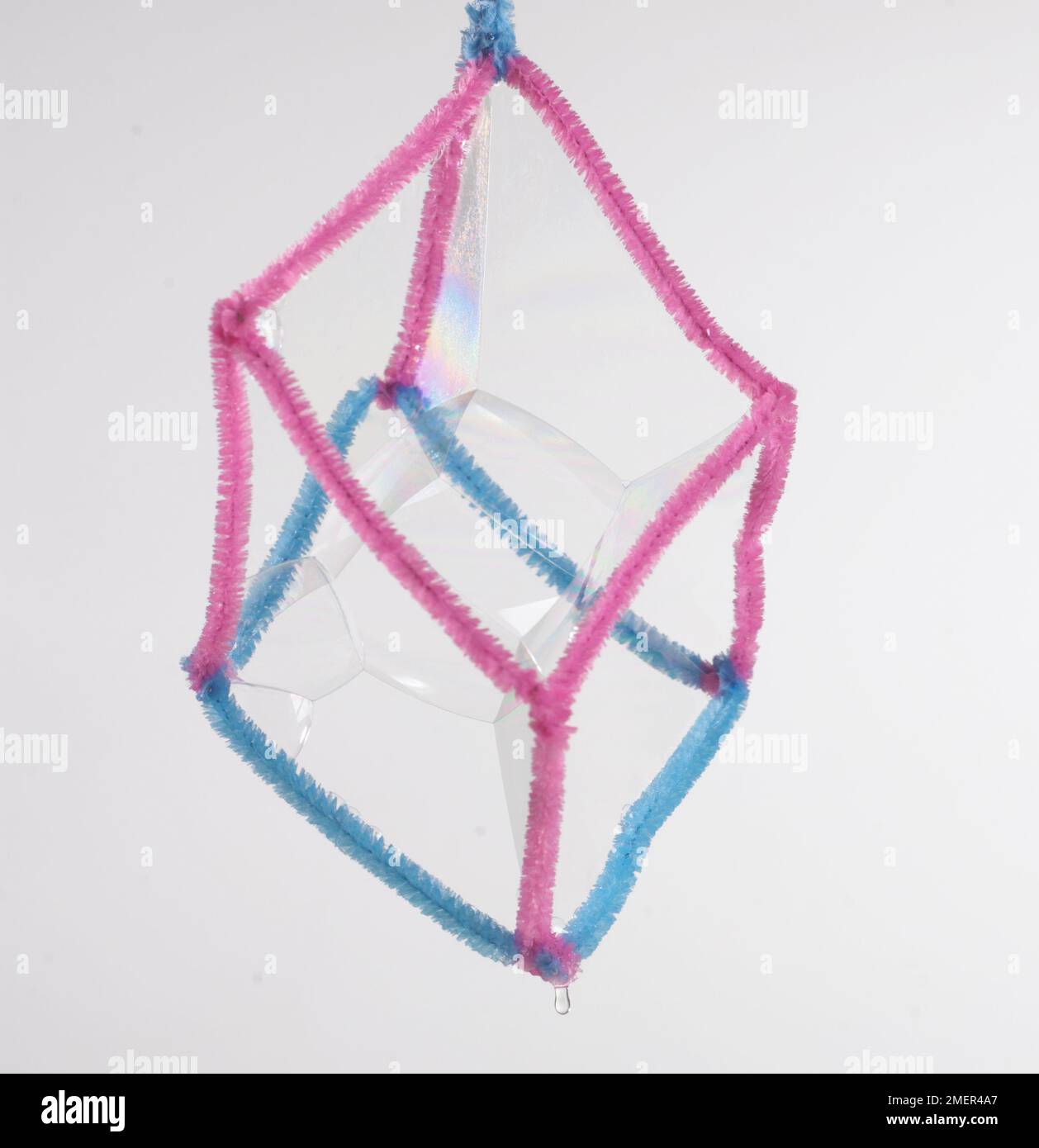 Cube made of pipe cleaners containing a soap bubble Stock Photo - Alamy