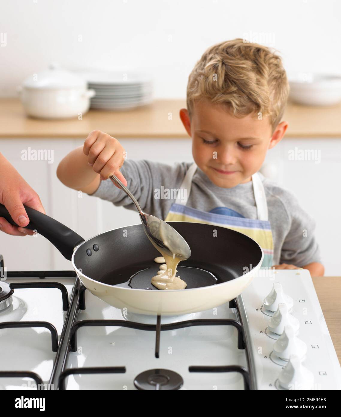 Boy spooning hi-res stock photography and images - Alamy