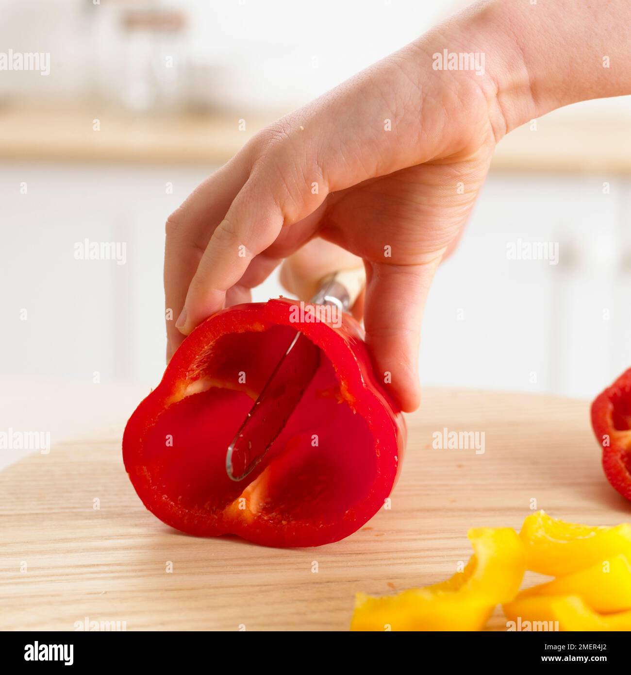 Cutting red pepper Stock Photo - Alamy