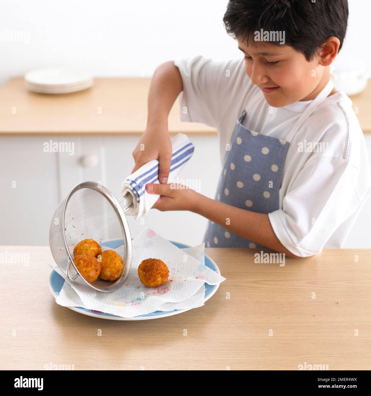 Child pouring rice hi-res stock photography and images - Alamy