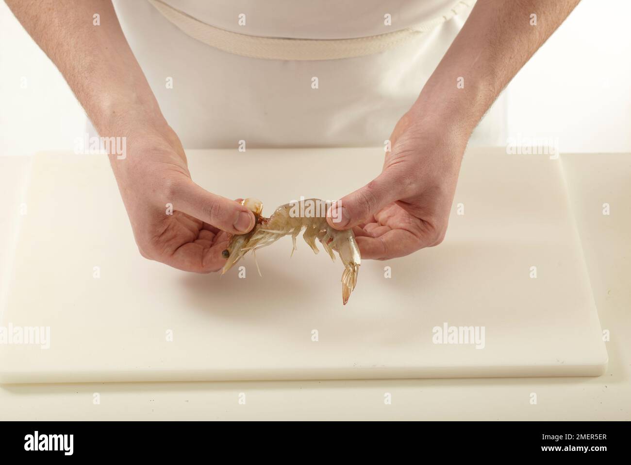 Peeling a prawn Stock Photo - Alamy