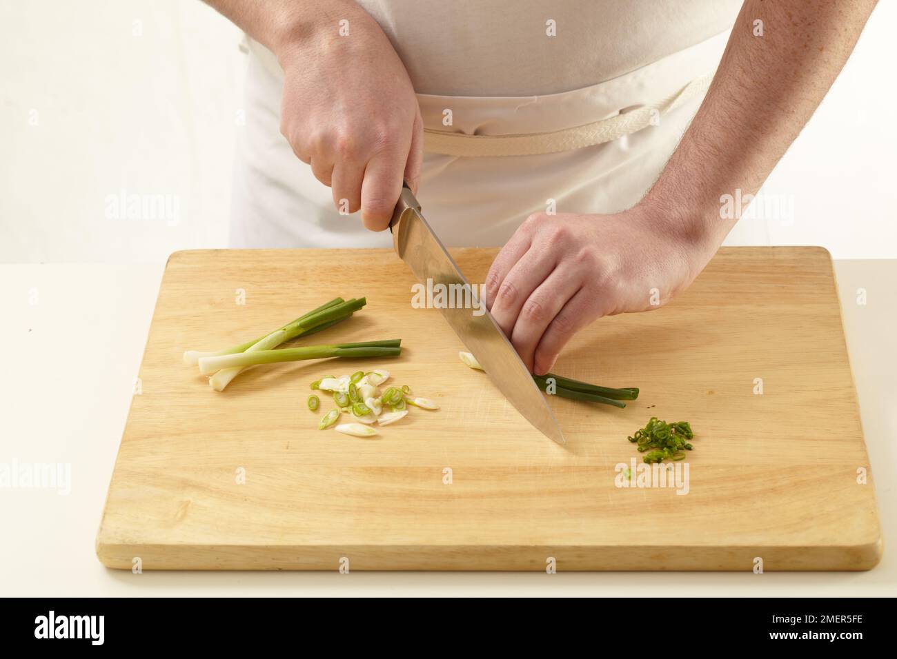Holding spring onions hi-res stock photography and images - Alamy