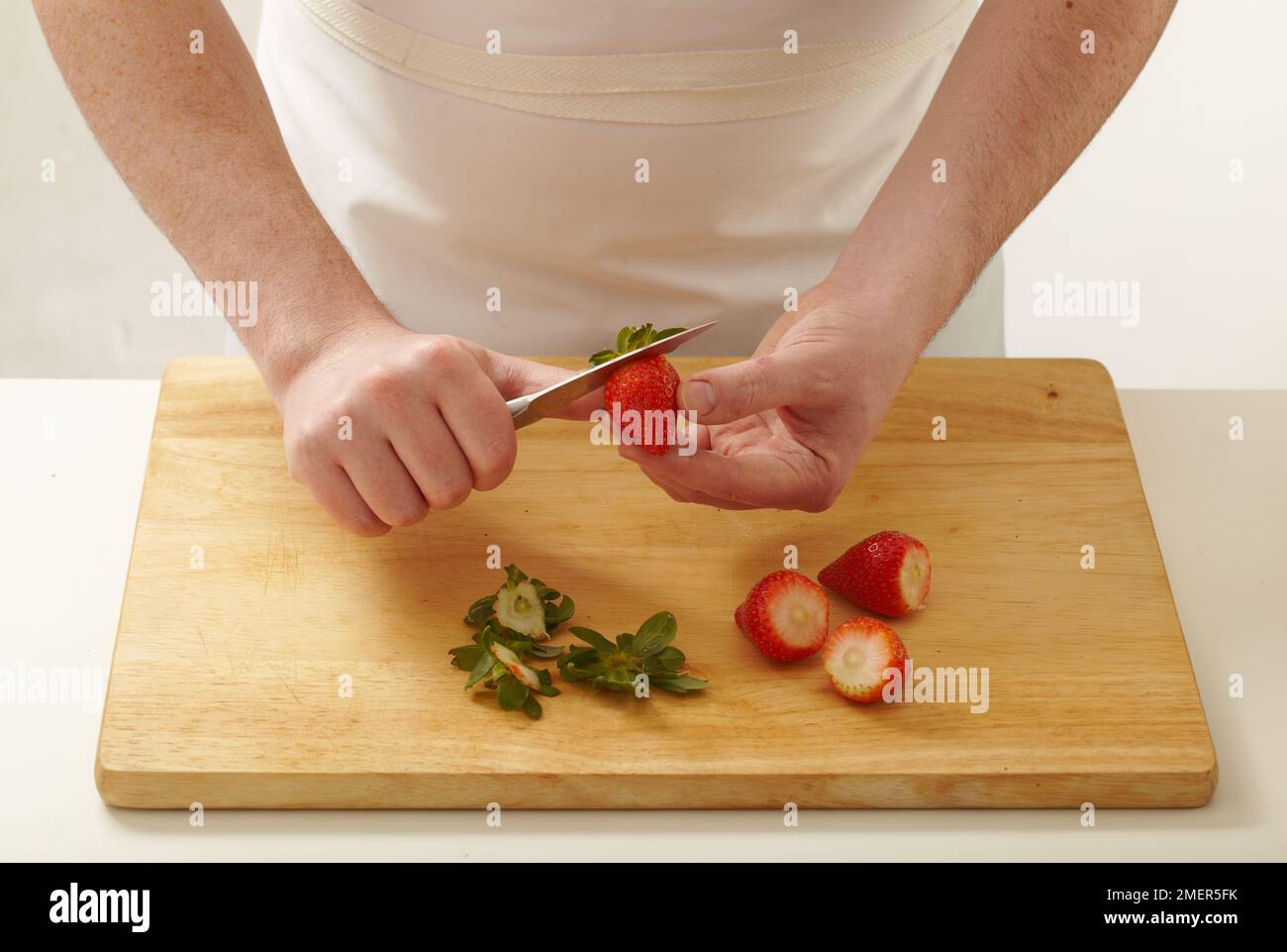 Hands cutting stalk board hi-res stock photography and images - Alamy